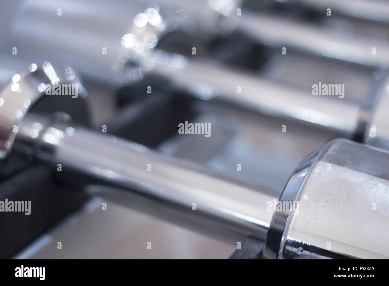Dumbbells gym metal weights in exercise room in gym health club fitness ...