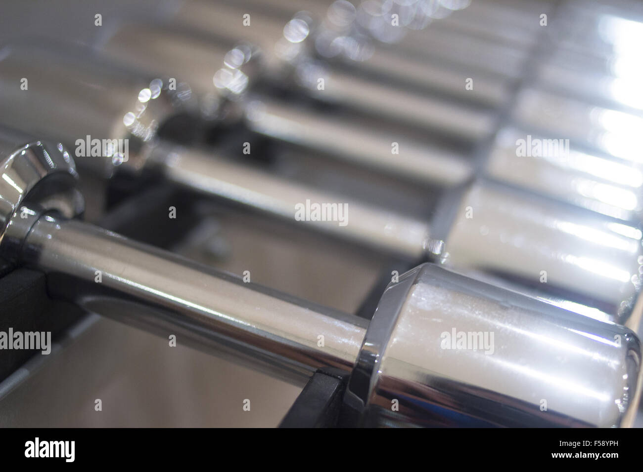 Dumbbells gym metal weights in exercise room in gym health club fitness ...