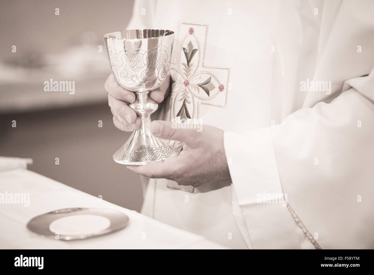 Black and white artistic digital photo of Catholic priest in church ...