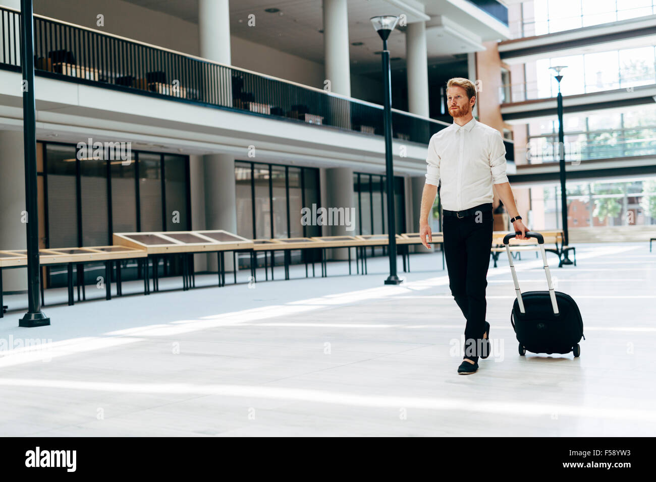 Man walking with trolley hi-res stock photography and images - Alamy