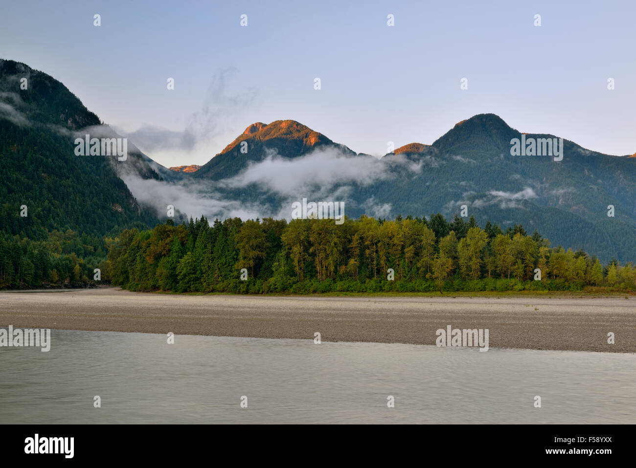 Morning skies with full moon over the Fraser River, Hope, British ...