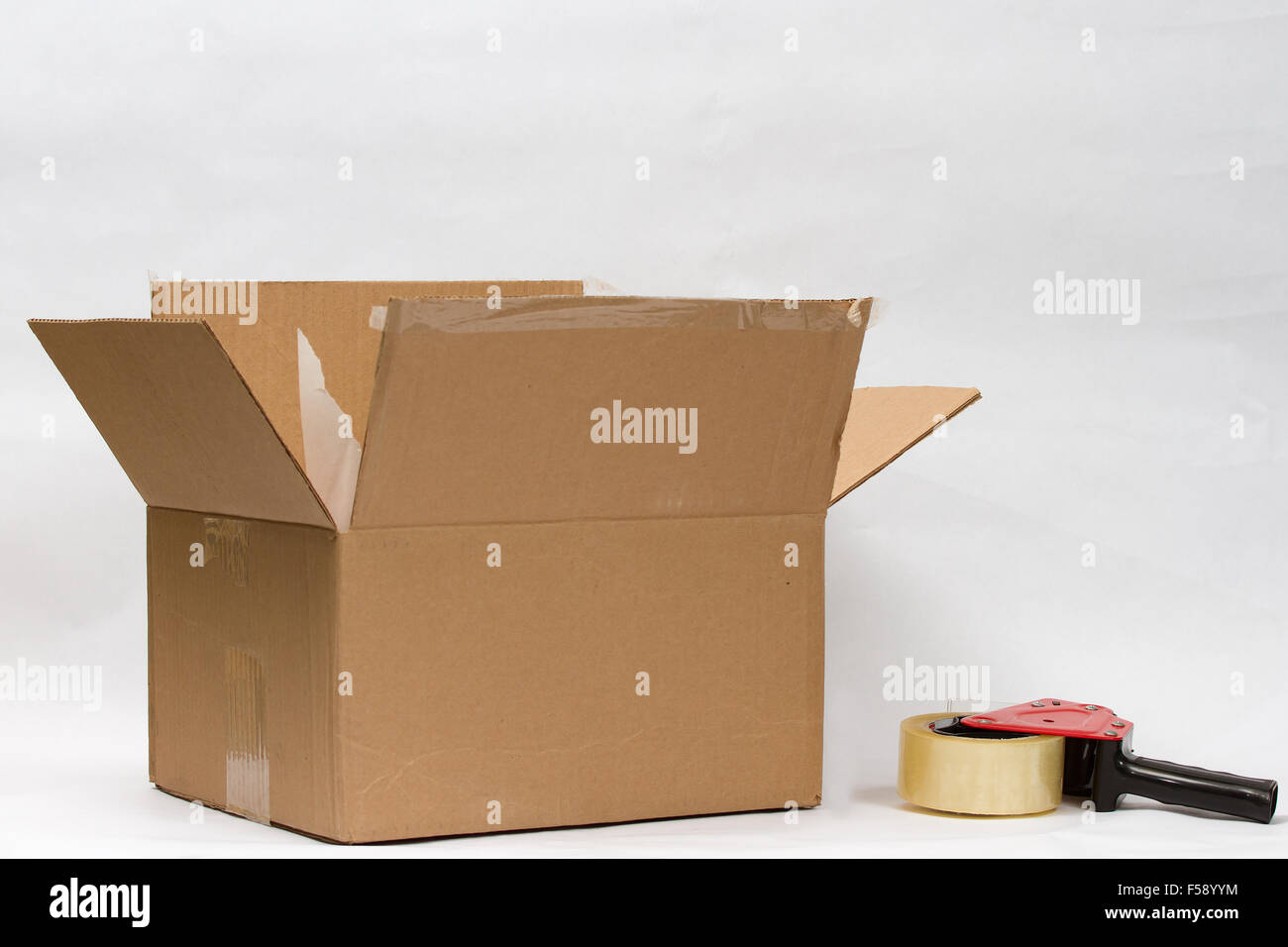 Packaging a box for shipping Stock Photo - Alamy