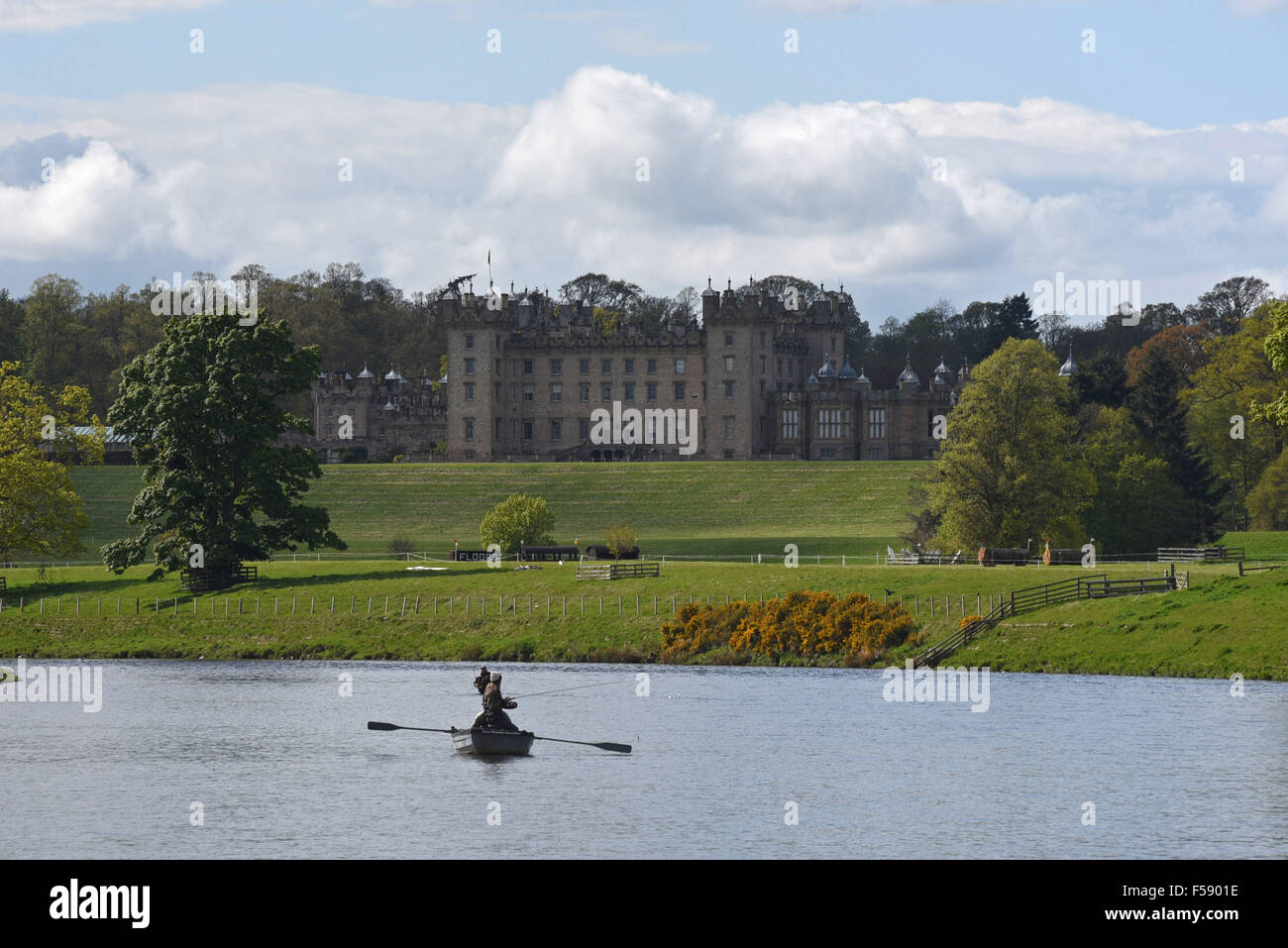 Floors Castle in Kelso in the Scottish Borders with fishermen in the ...