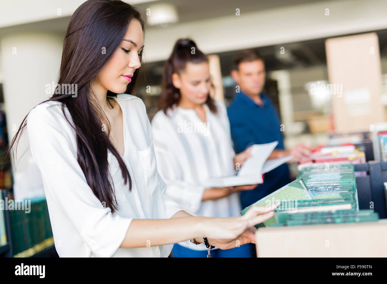 Smart students reading and studying in library whole searching through ...