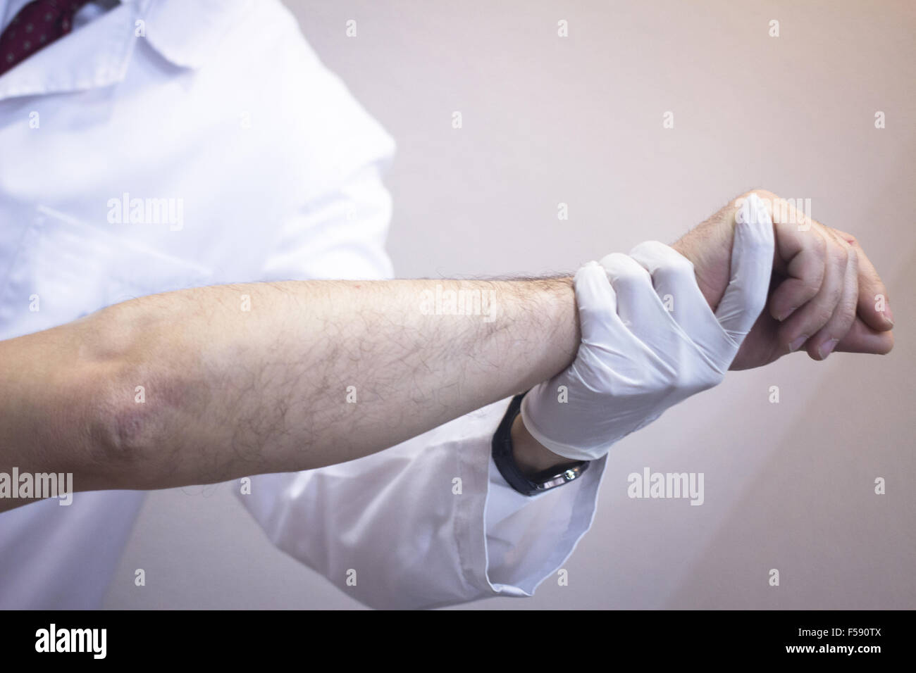 Male Traumatologist orthopedics surgeon doctor examining middle aged ...