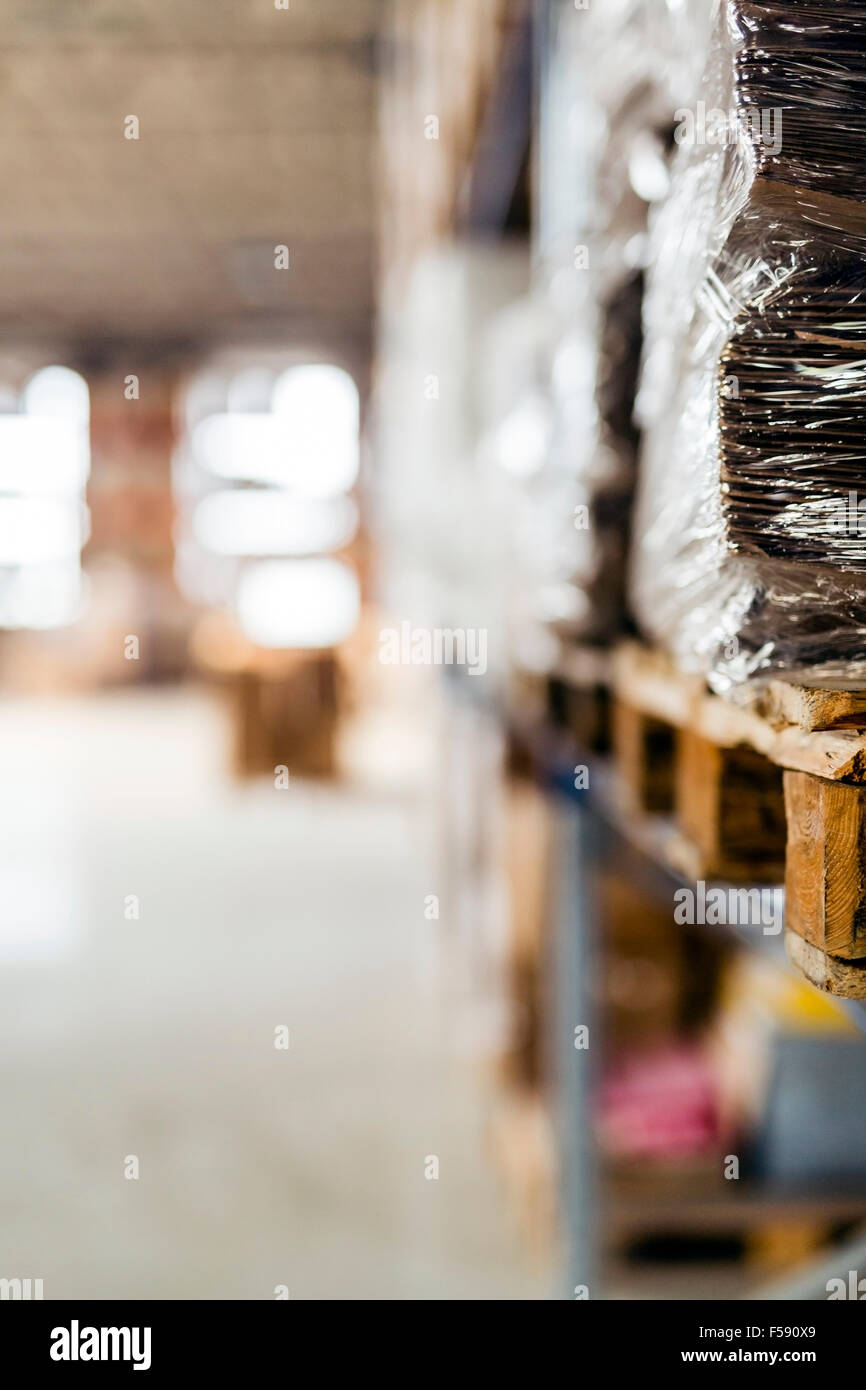 Pallets storing goods in an industrial warehouse Stock Photo - Alamy