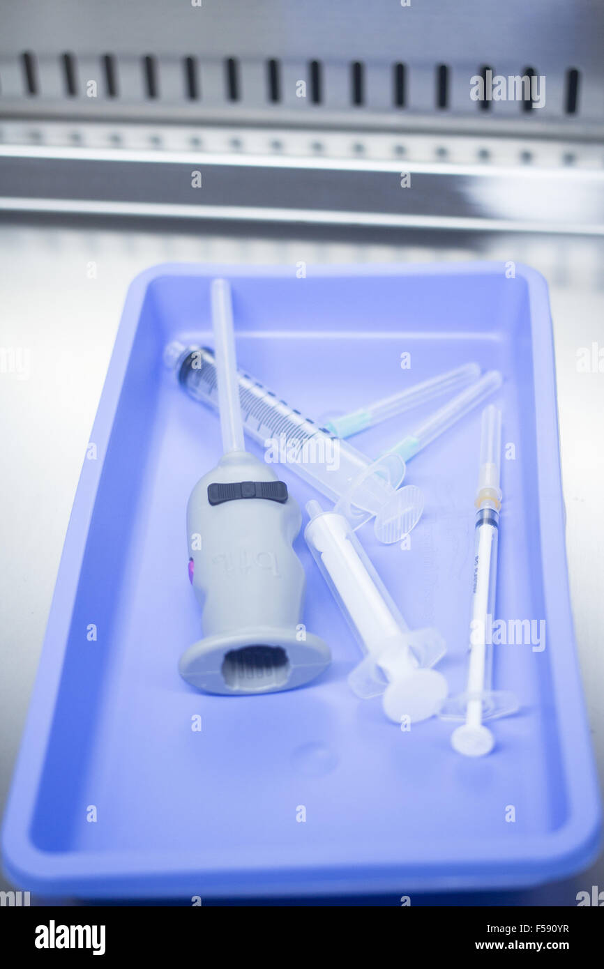 Medical laboratory syringe, sterile swab and tray used for preparation ...