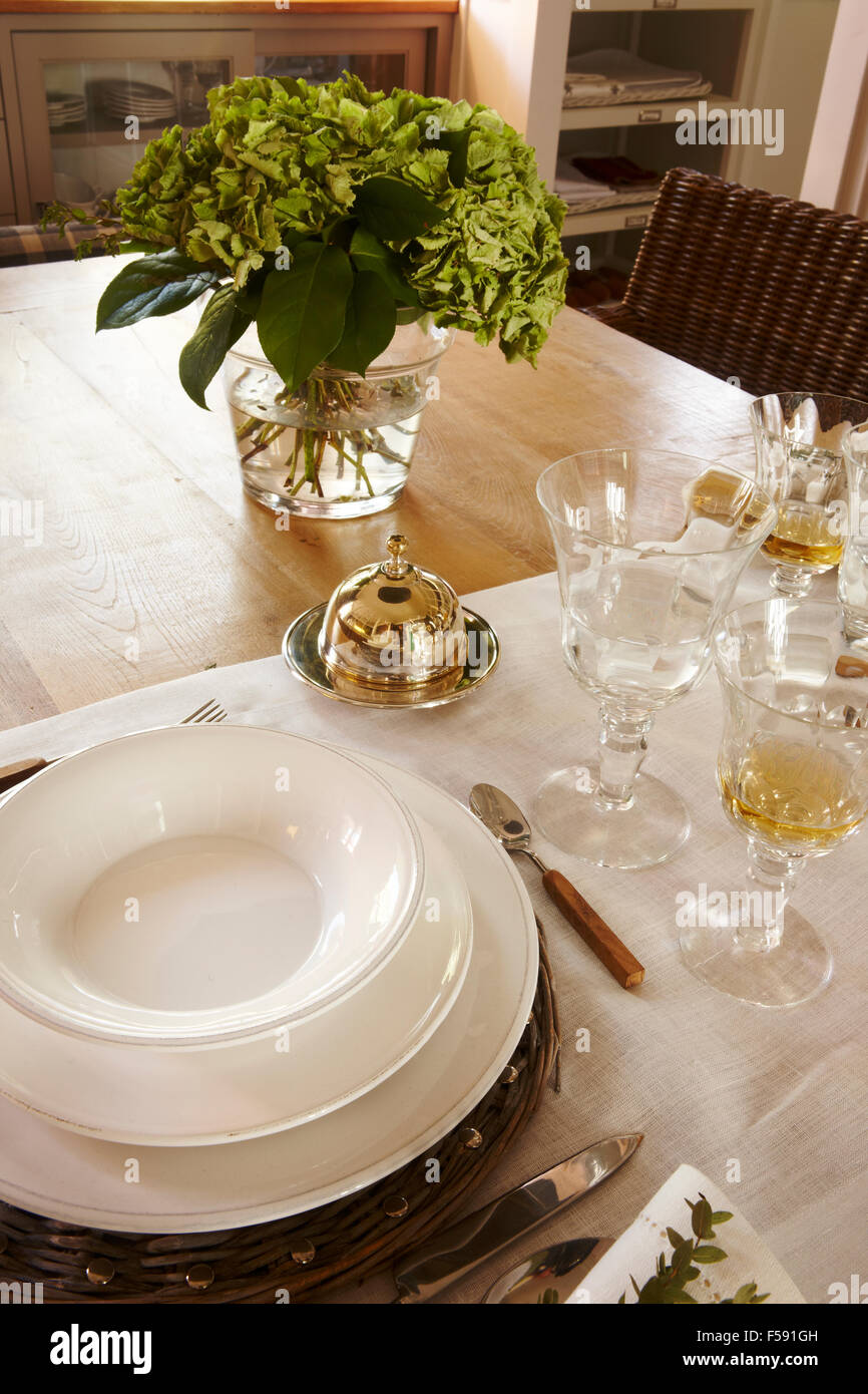 Dishware on a table glass, ceramic and cutlery vertical Stock Photo - Alamy