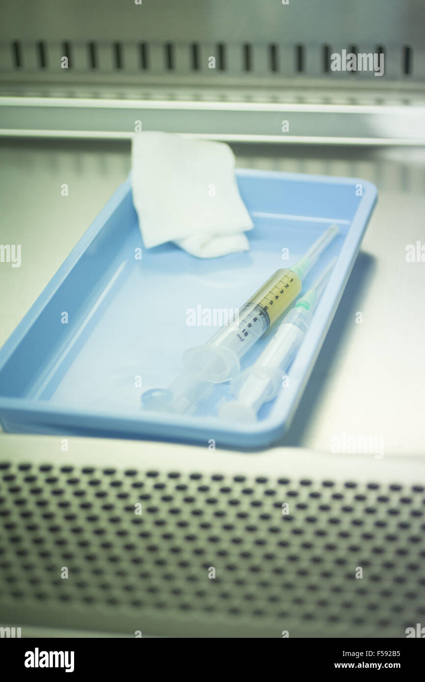Medical laboratory syringe, sterile swab and tray used for preparation ...