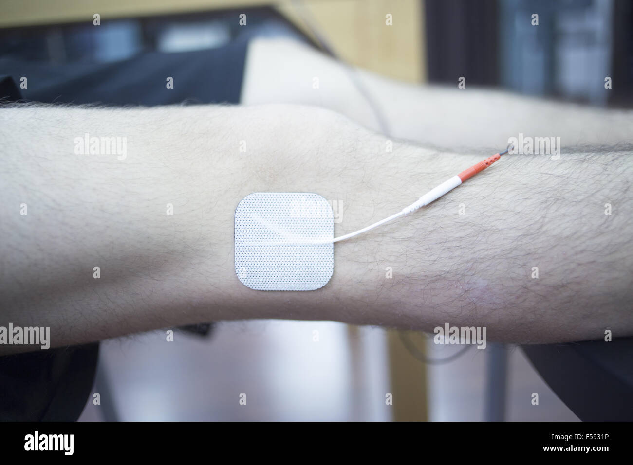 Patient knee, leg, thigh and calf in physiotherapy electrical impulse ...