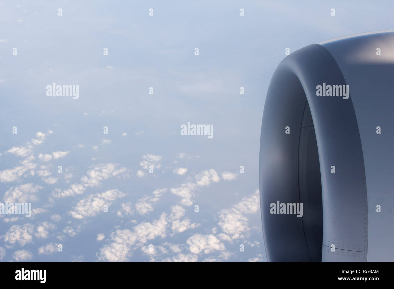 Airplane flying in sky in flight engine wing Stock Photo - Alamy