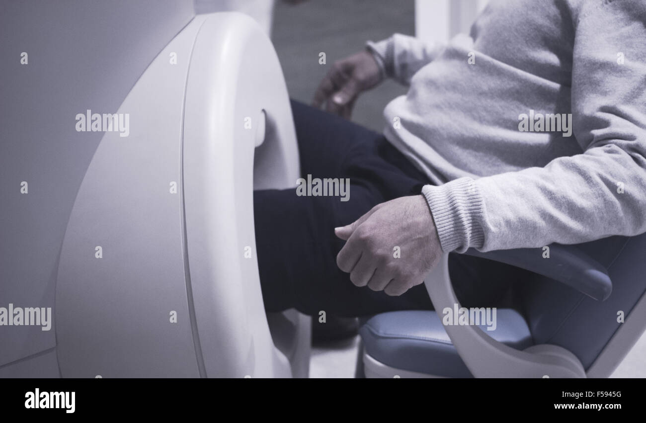 Patient in fully open high field Magnetic Resonance Image MRI scanner ...