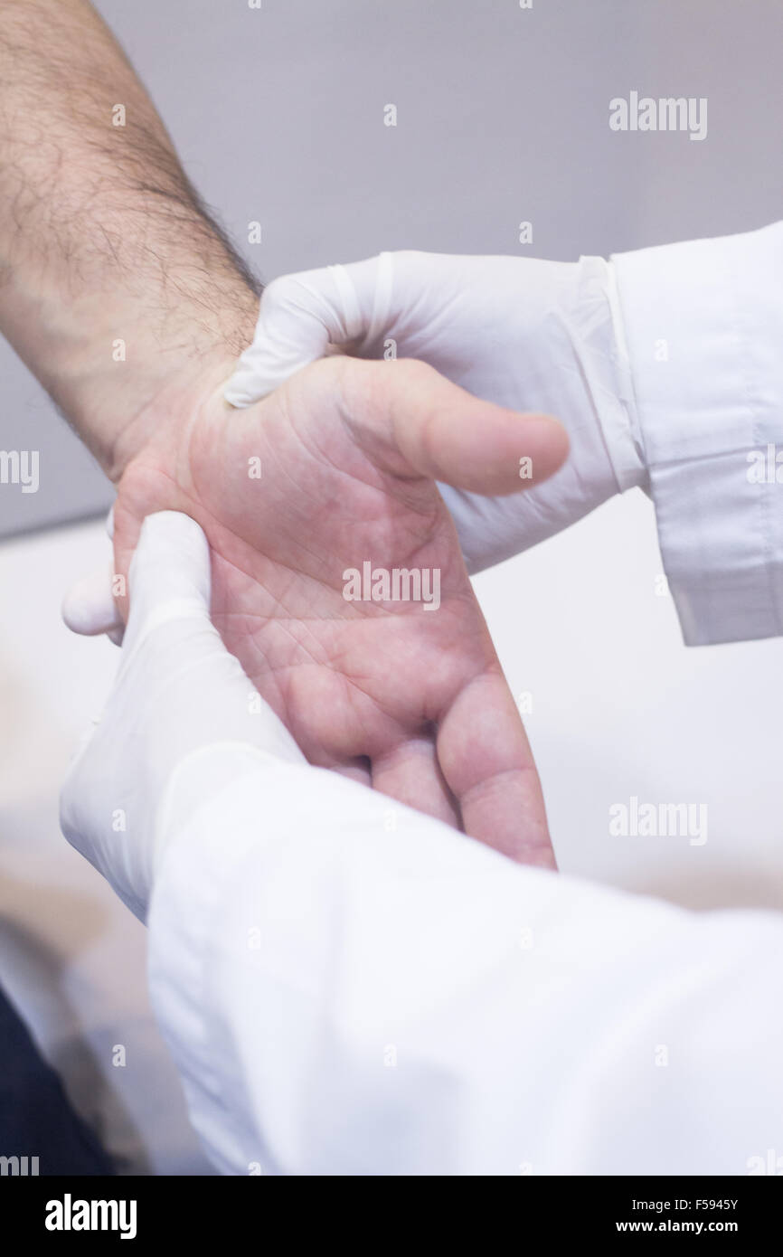 Male Traumatologist orthopedics surgeon doctor examining middle aged ...