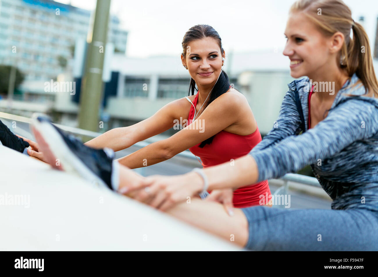 Women stretching outdoor before running Stock Photo - Alamy