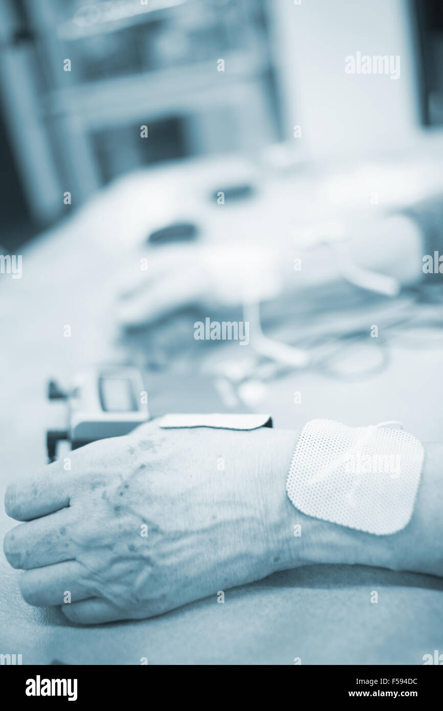 Patient hand, wrist and arm in electro physiotherapy electrical impulse ...