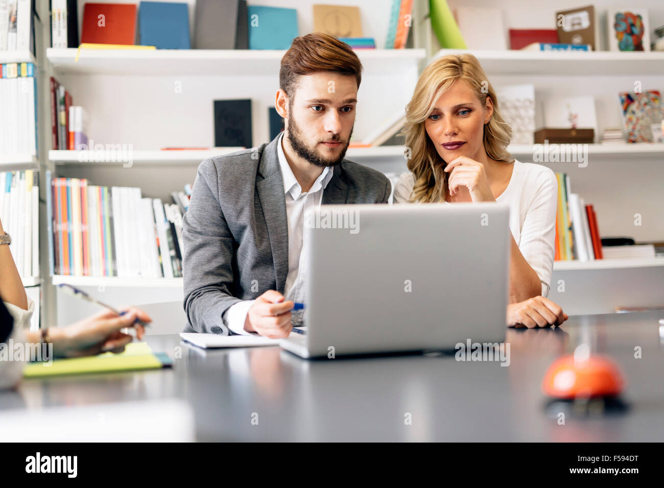 Two colleagues trying to solve problem on laptop Stock Photo - Alamy Two colleagues trying to solve problem on laptop Stock Photo - Alamy