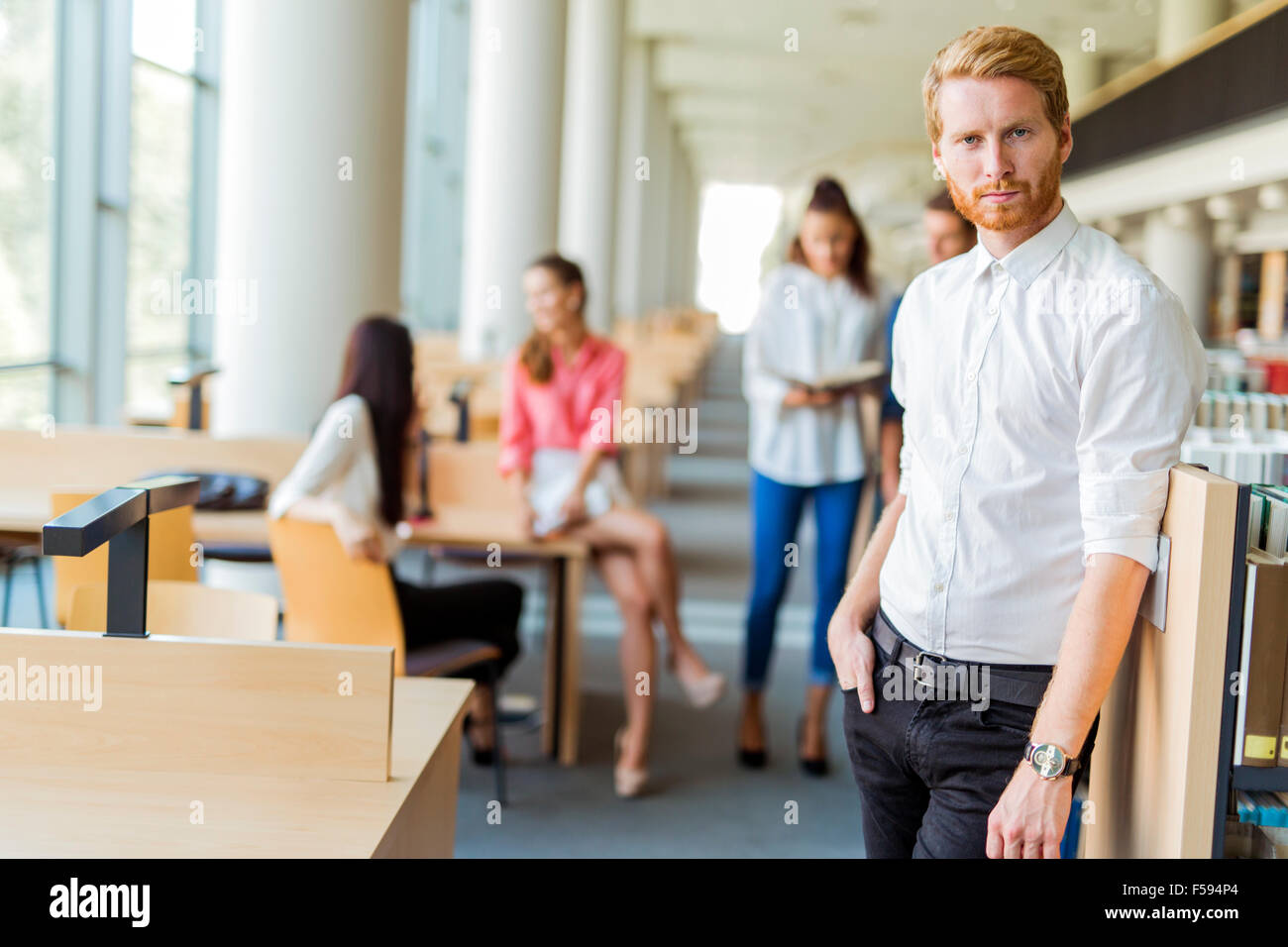 Group of smart young people educating themselves in a library Stock ...