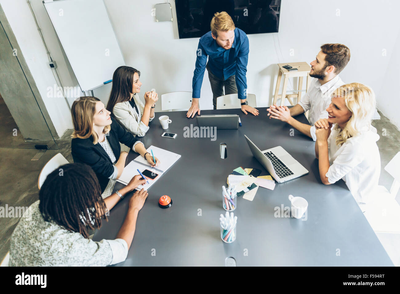 Office brainstorming, people sitting at desk Stock Photo - Alamy