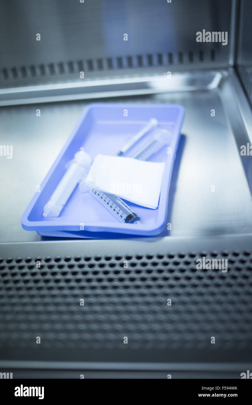 Medical laboratory syringe, sterile swab and tray used for preparation ...