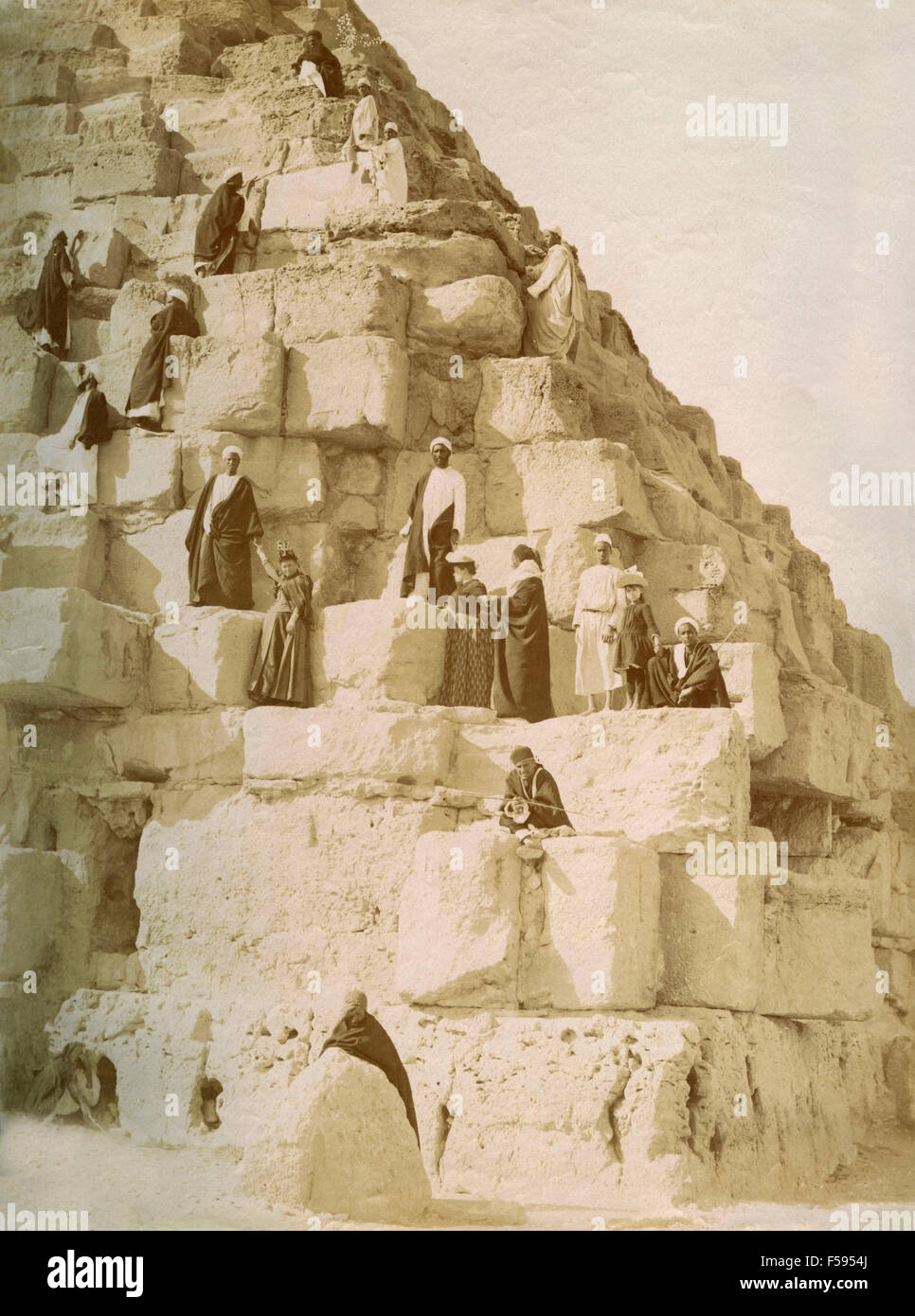Tourists climbing the pyramids, Egypt Stock Photo - Alamy