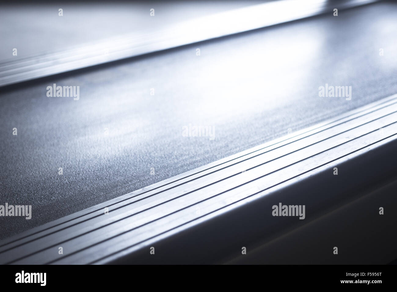 Running machine in exercise room in sports bodybuilder gym health club ...