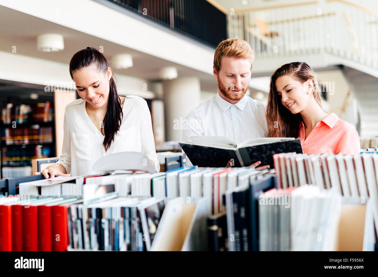 Group reading hi-res stock photography and images - Alamy