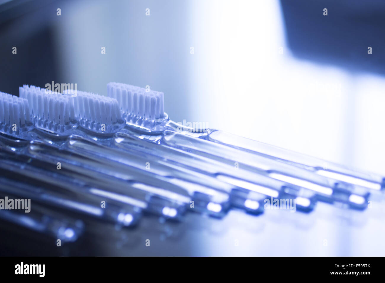 Toothbrushes on glass table dental hygiene plaque control in dentists ...