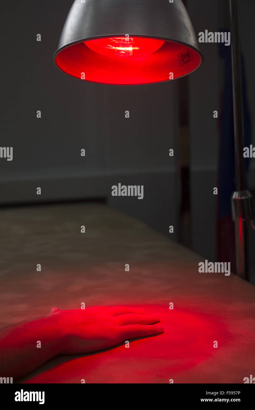 Hand, fingers, forearm and arm of injured patient receiving treamente ...