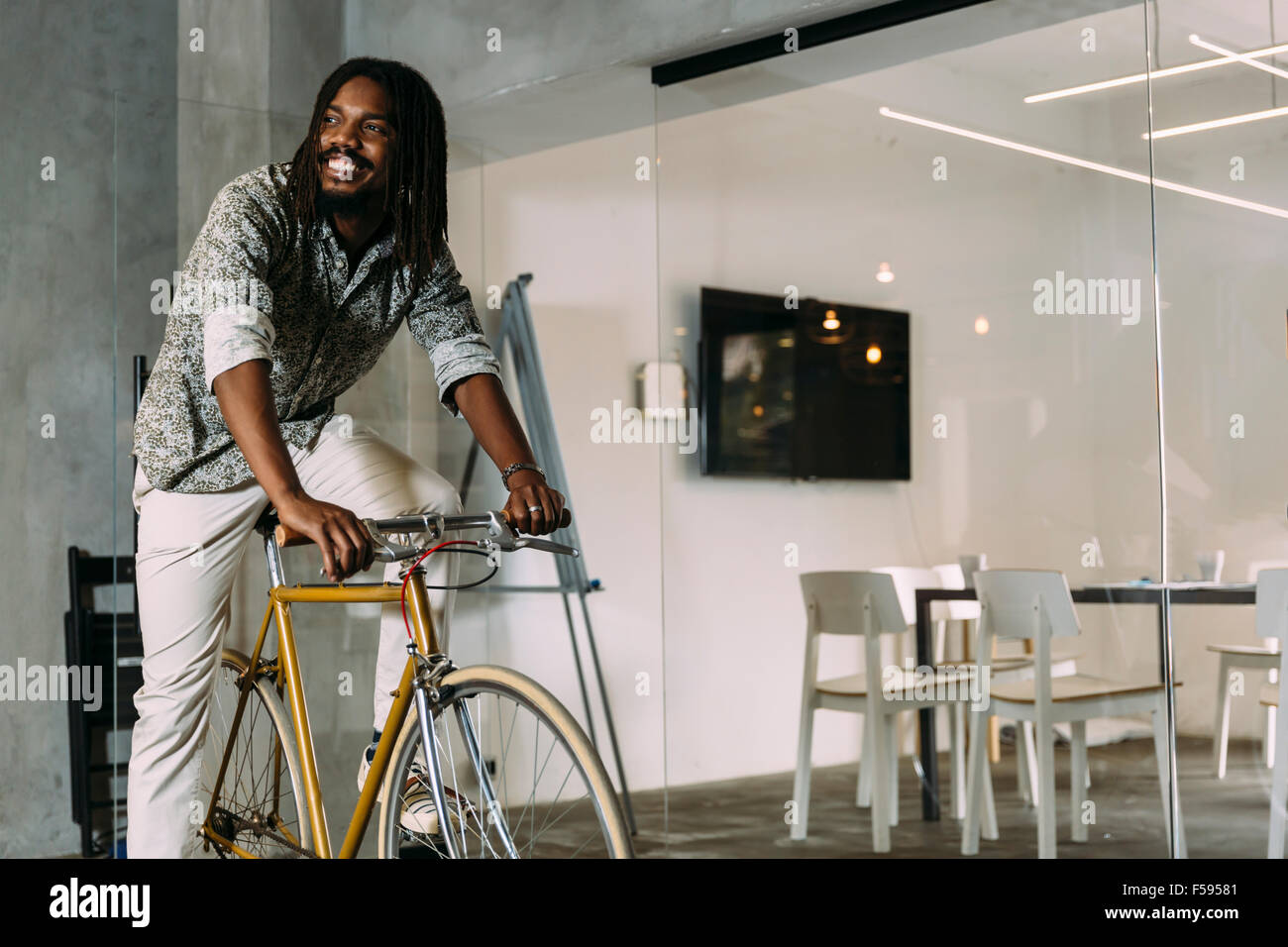 Businessman riding a bicycle to work Stock Photo - Alamy