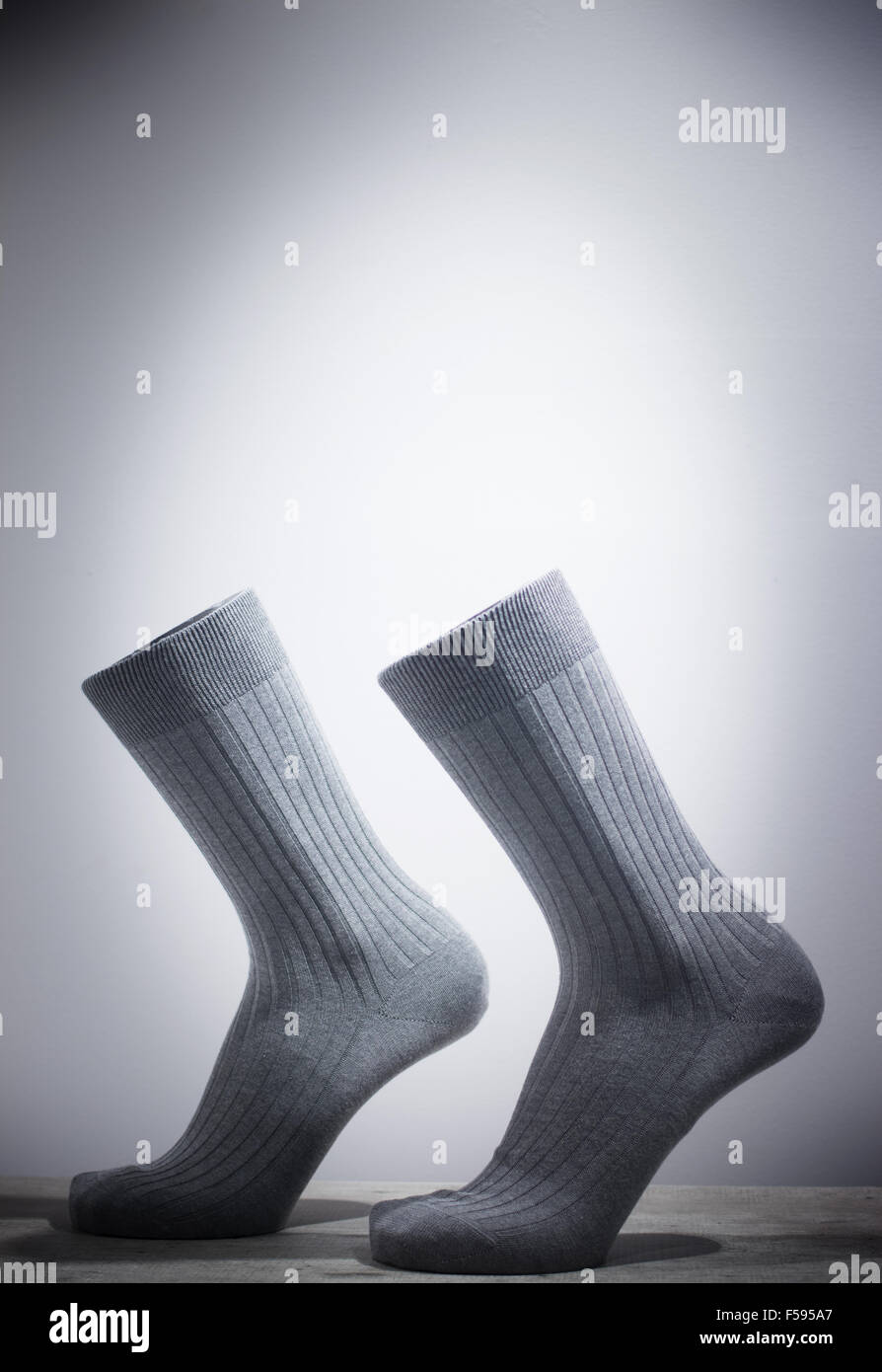 Surrealist socks and feet walking without legs attached Stock Photo - Alamy