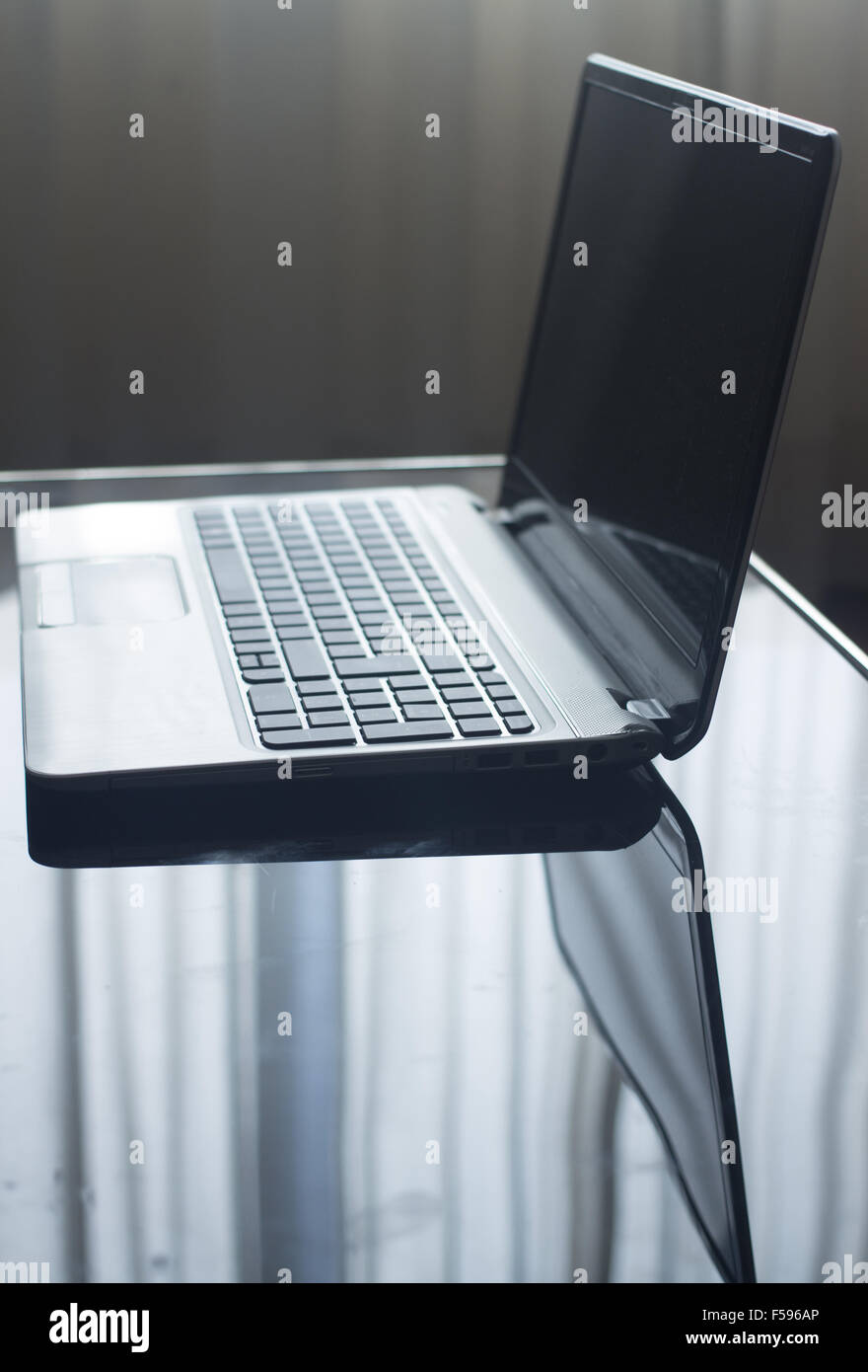 Laptop PC portable notebook computer keyboard screen on glass cofee ...