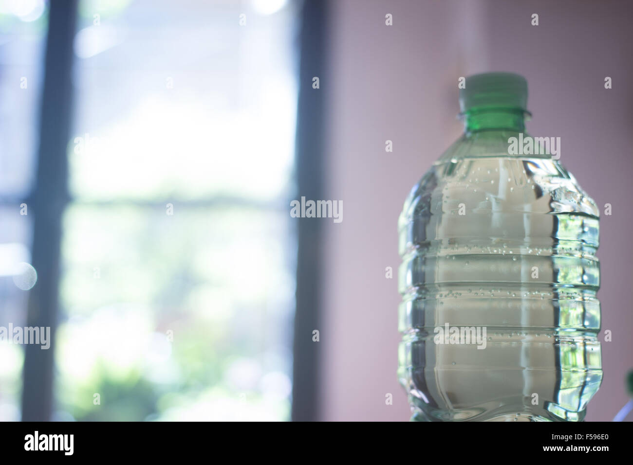 Plastic water bottle in window light closeup color photo Stock Photo ...