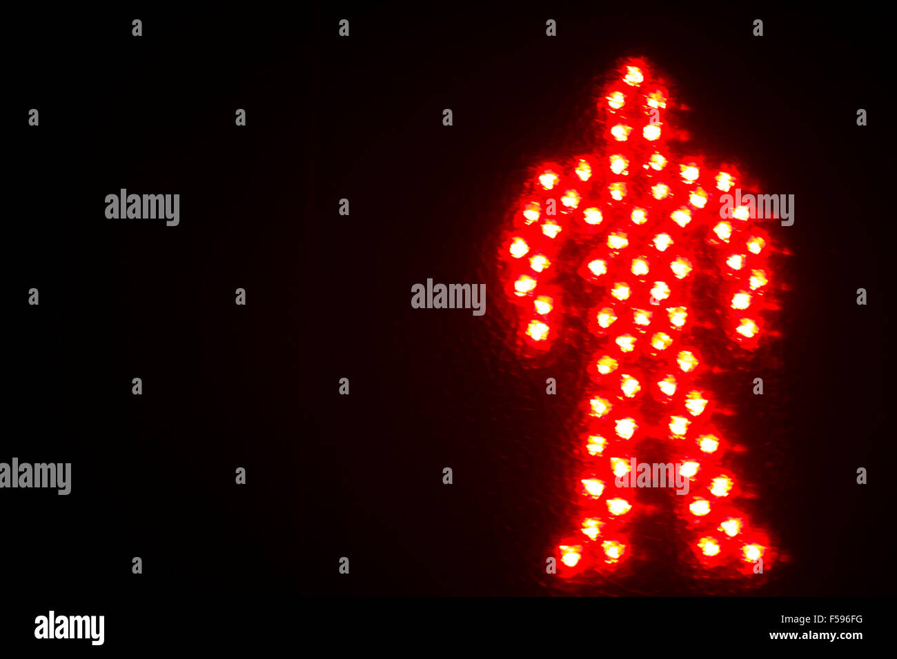 Red man pedestrian stop traffic light photo at night on black ...