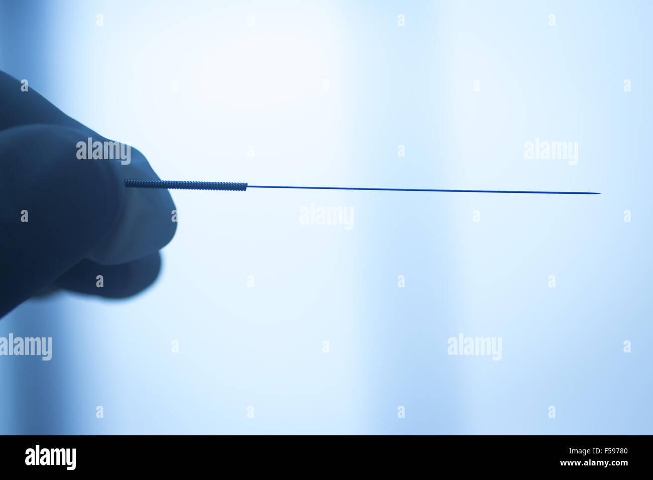 Doctor hand acupuncture needle photo in medical center hospital clinic ...