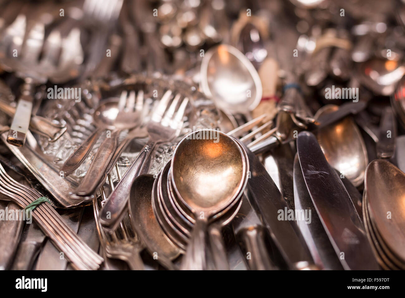 bunch of old silver ware on a flea market Stock Photo - Alamy