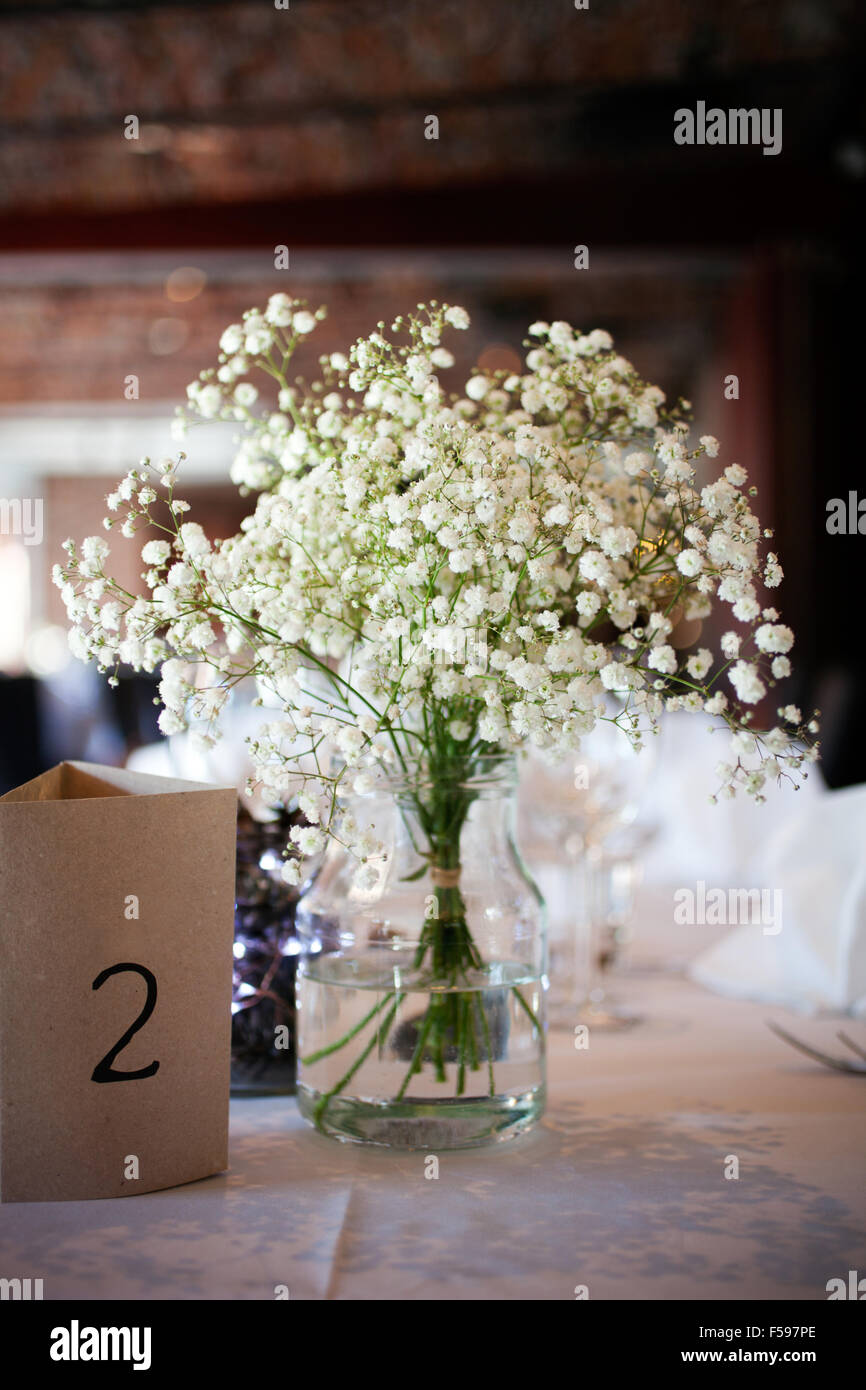 Wedding table setting with elegant white decoration Stock Photo - Alamy