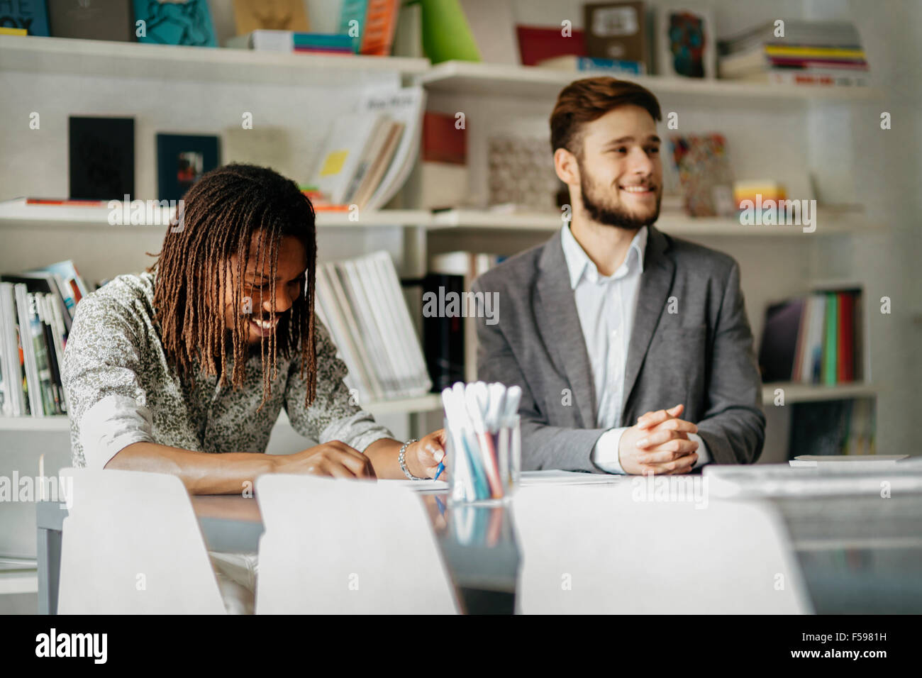 Students preparing for exams by studying in library Stock Photo - Alamy