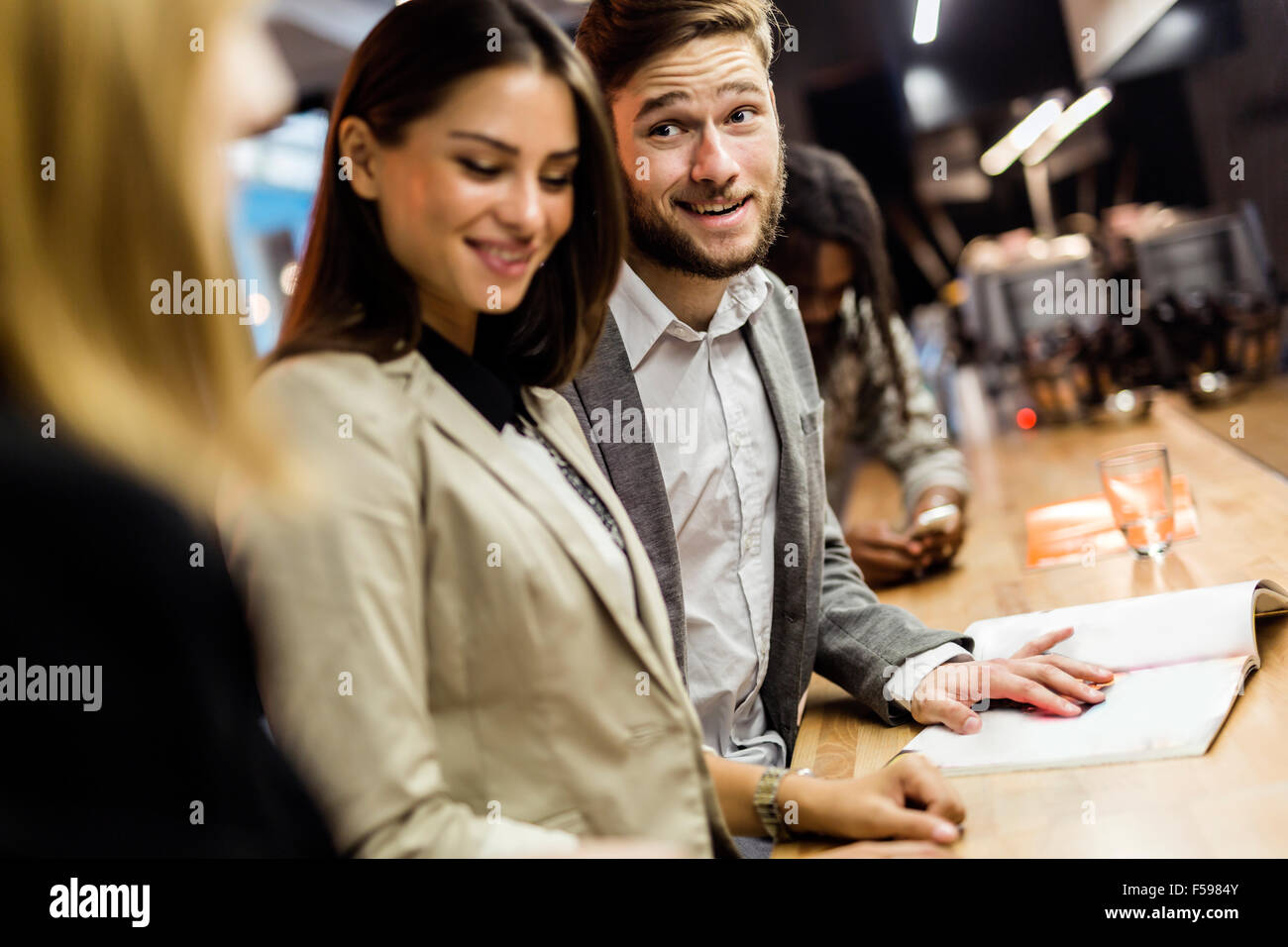 Business people drinking and relaxing in a pub after work Stock Photo ...