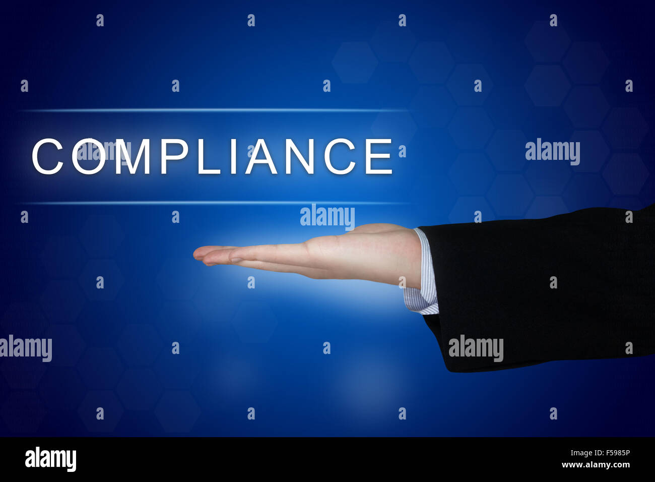 compliance button with business hand on blue background Stock Photo - Alamy