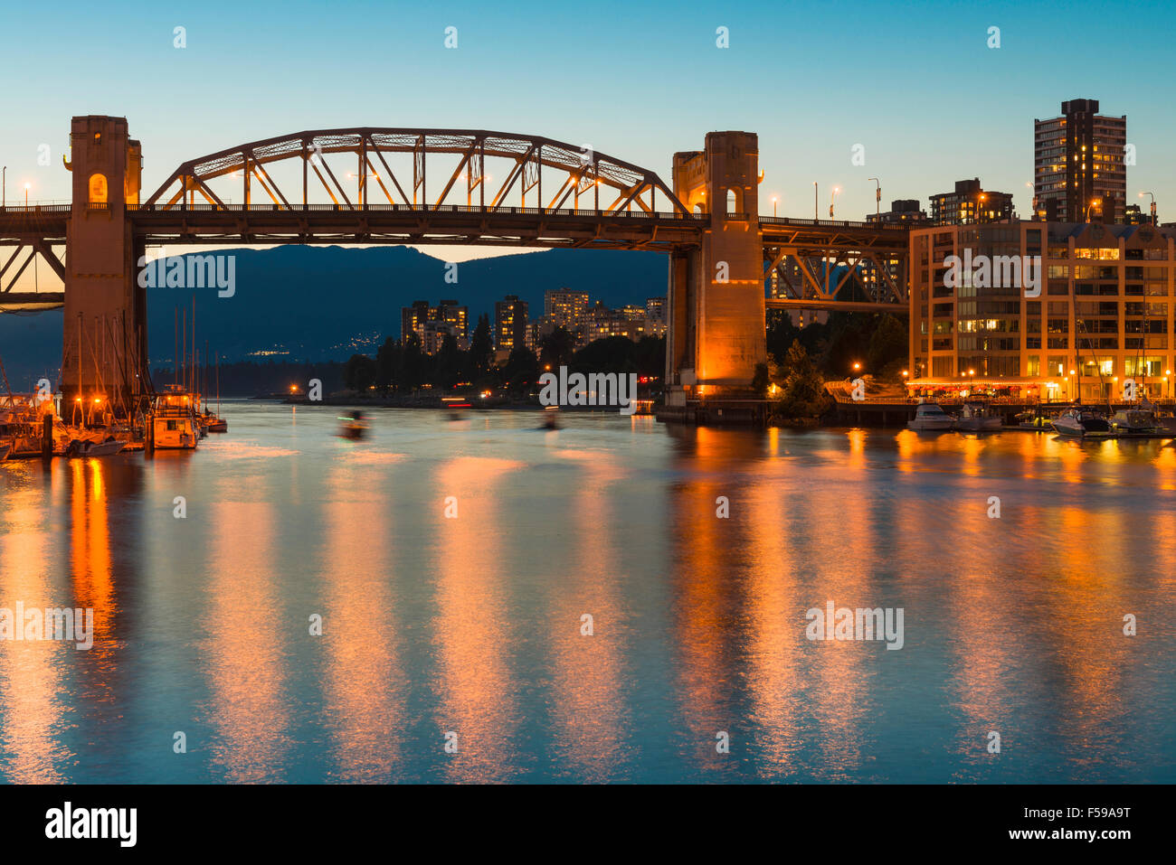 Evening view of Burrard Street Bridge (1932) and English Bay beyond ...