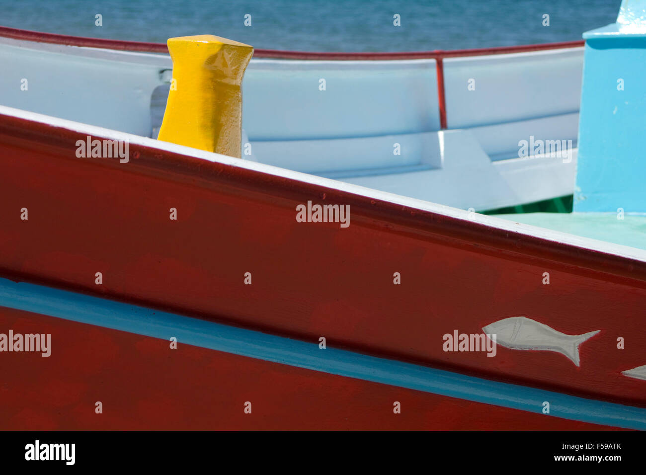 Traditional fisherman's wooden boat stern side painted with vivid ...