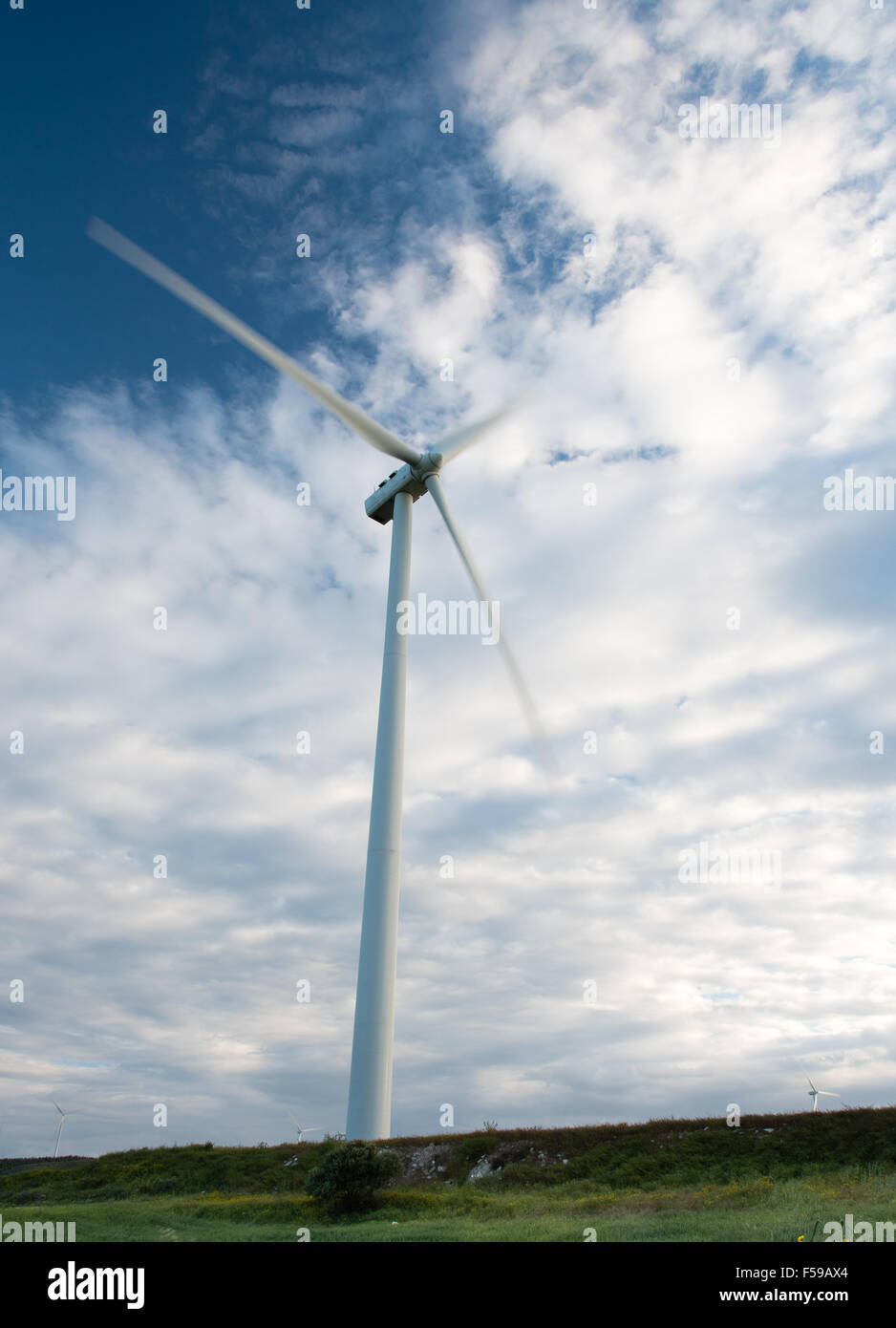 Windmills power generators on a turbine farm generating electricity ...