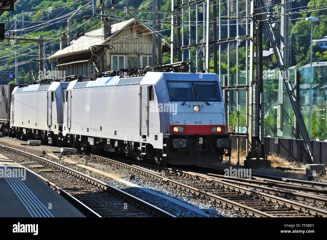 Class 186 electric locomotives double head a freight through Brig ...