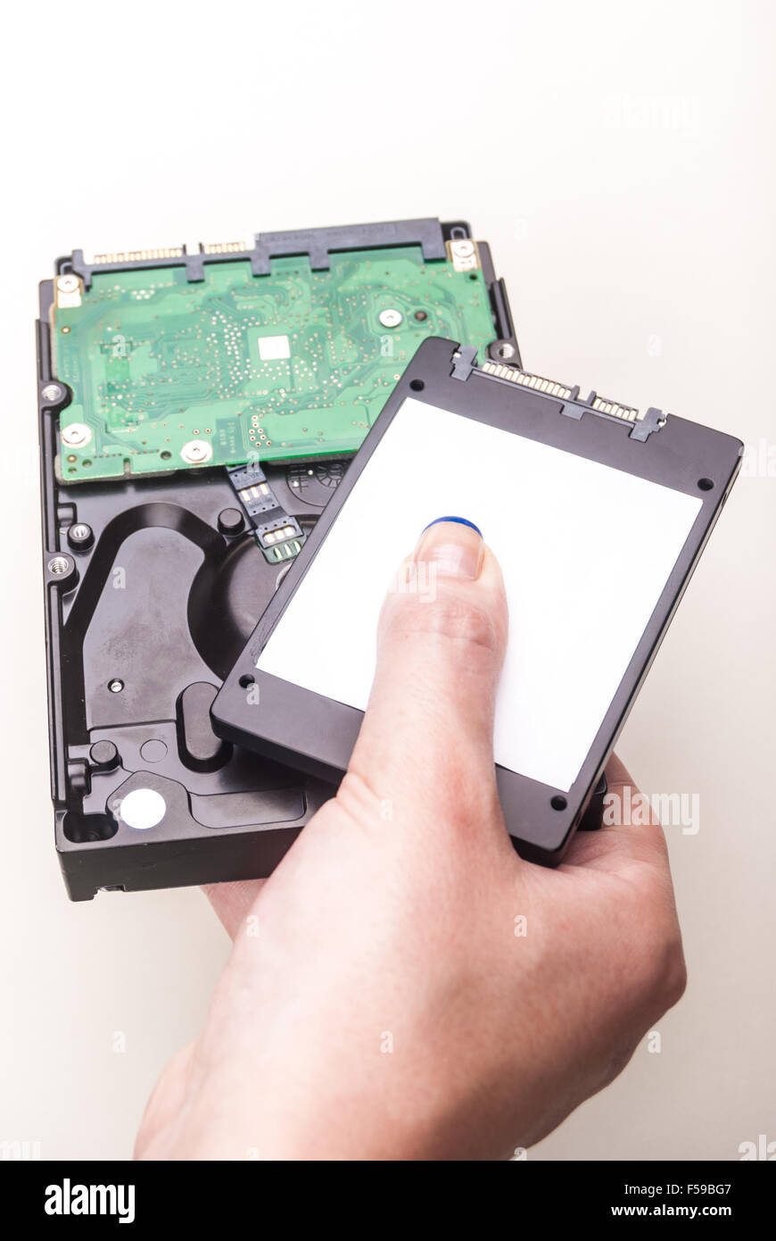 Female hand with Hard Drive on white Stock Photo - Alamy