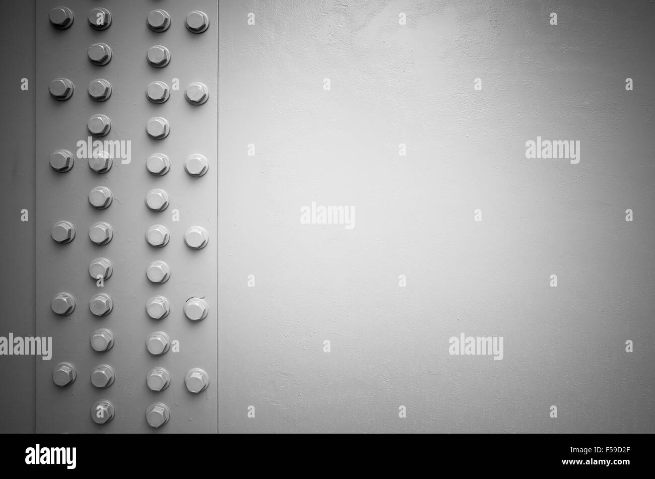White steel wall with bolts, metal parts connection, background with ...