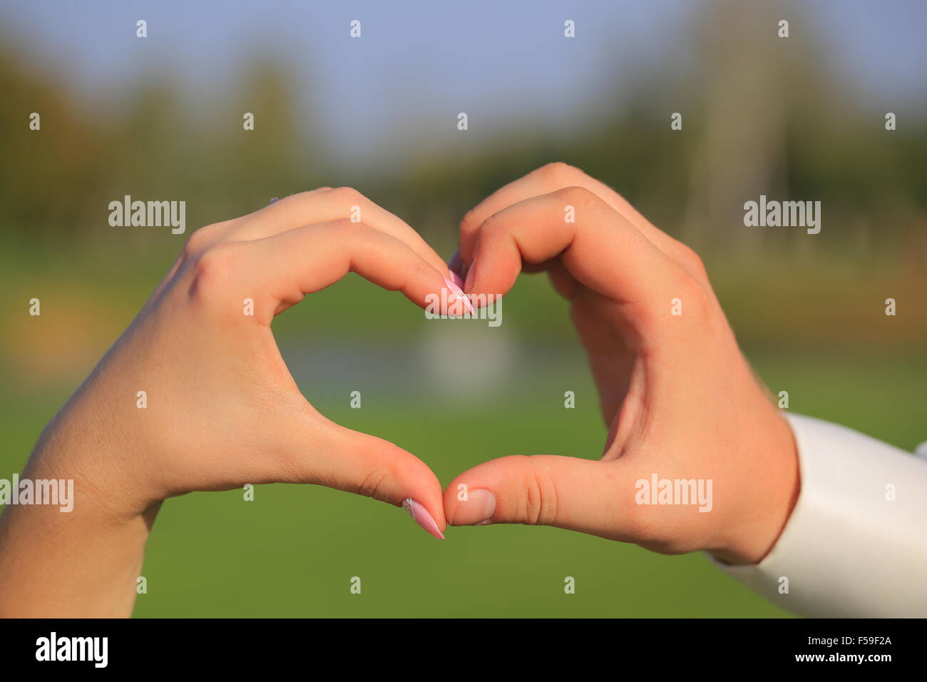 Heart of hands Stock Photo - Alamy