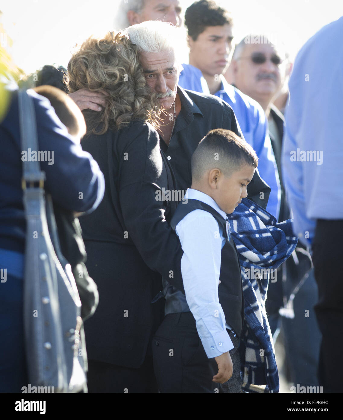 Albuquerque, New Mexico, USA. 27th Oct, 2015. Mourners comfort each ...