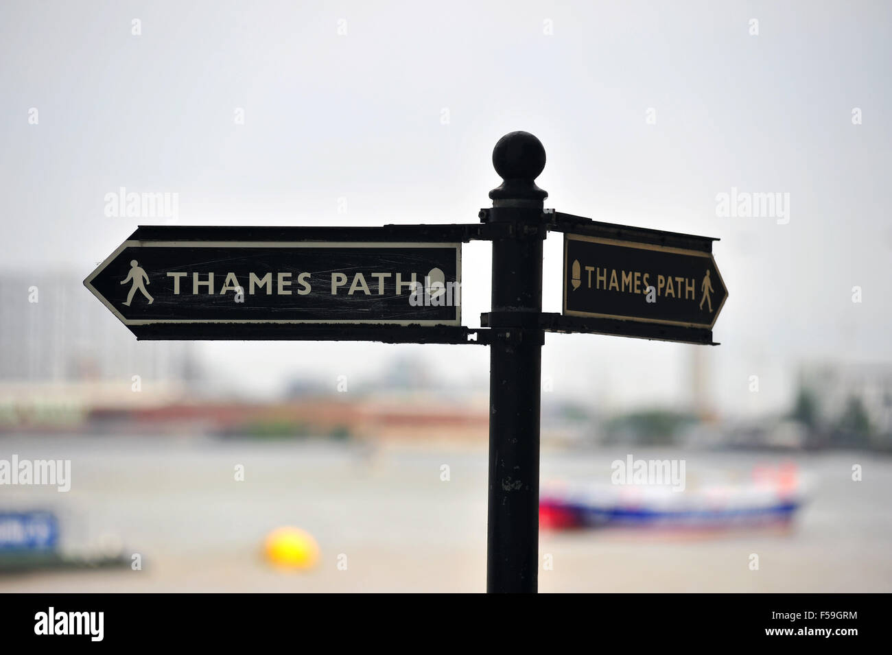 A Thames path sign by the river Thames in Greenwich, London Stock Photo ...
