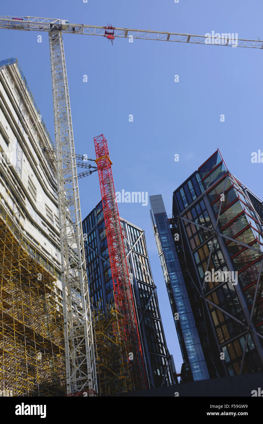 Tower cranes amidst tall buildings in the centre of London in the UK ...