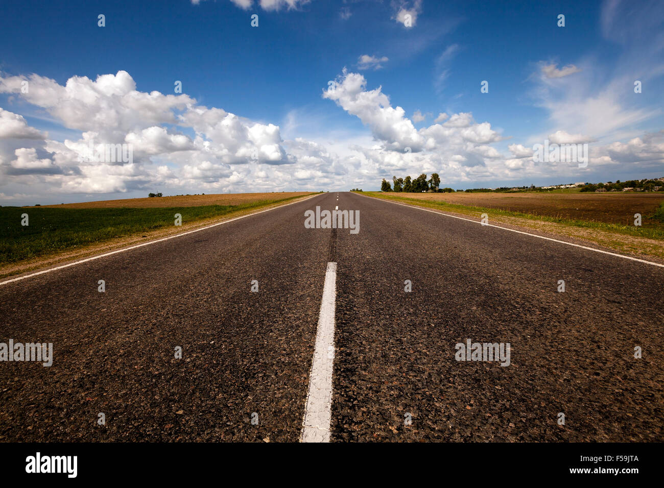 Summer road . field Stock Photo - Alamy